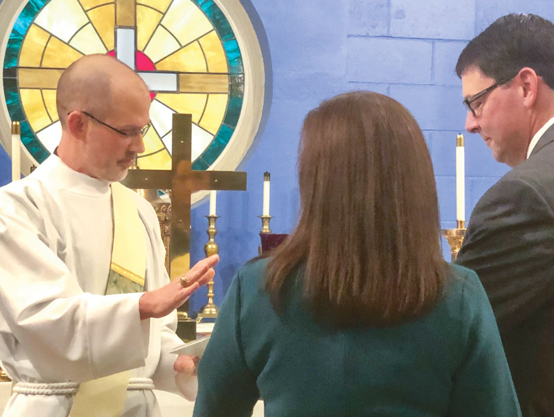 Deacon at St. Clare of Assisi undergoes trial by fire - The Catholic ...