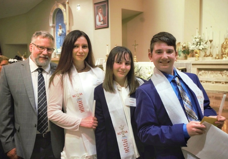 Neophytes follow the light of Christ into the Church - The Catholic ...